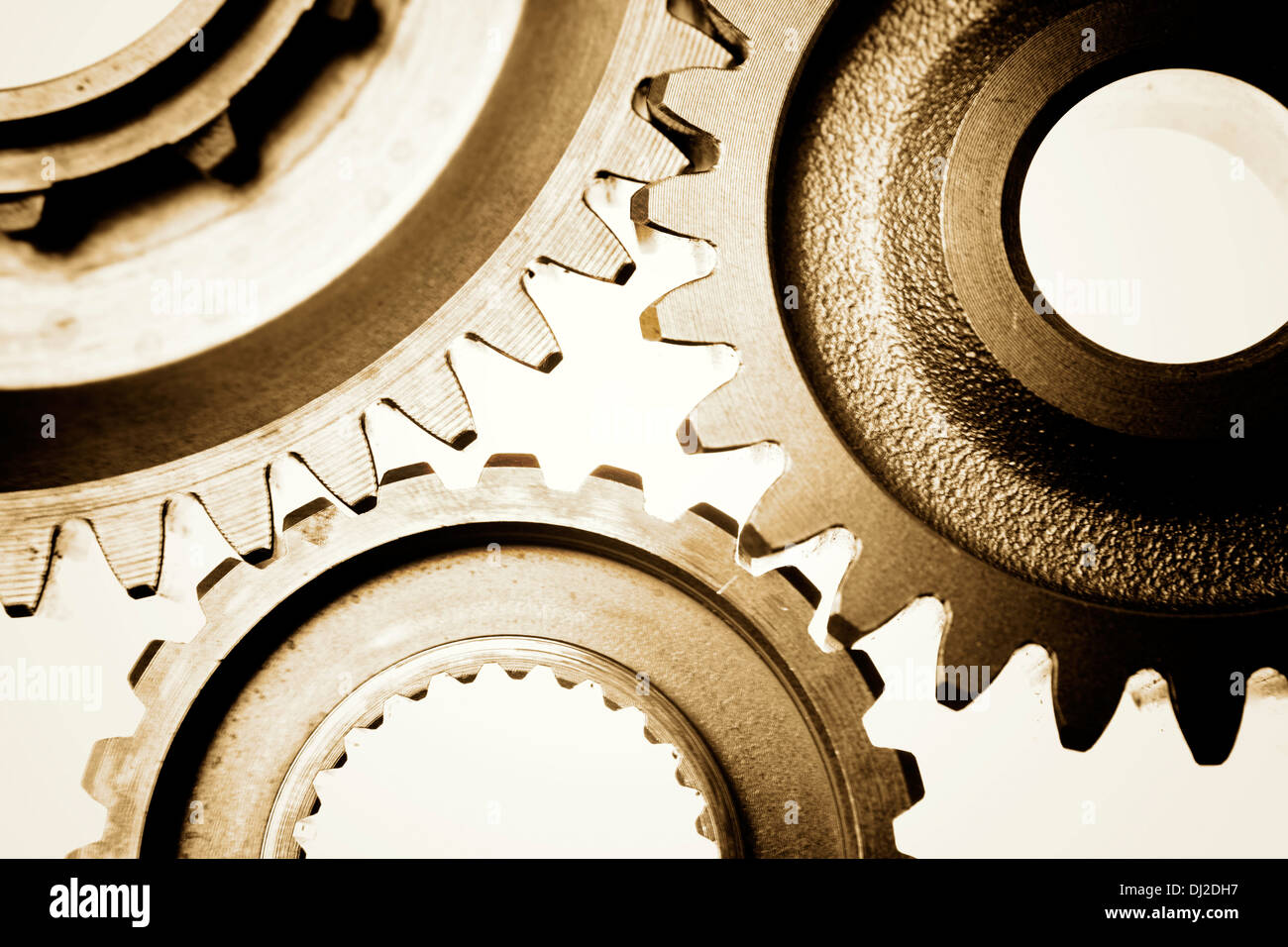Metal cog gears joining together Stock Photo - Alamy