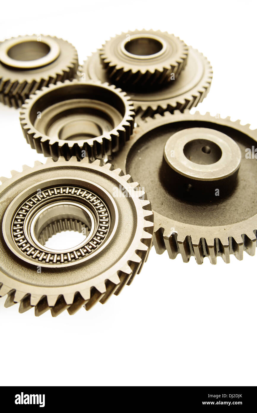 Metal cog gears joining together Stock Photo - Alamy