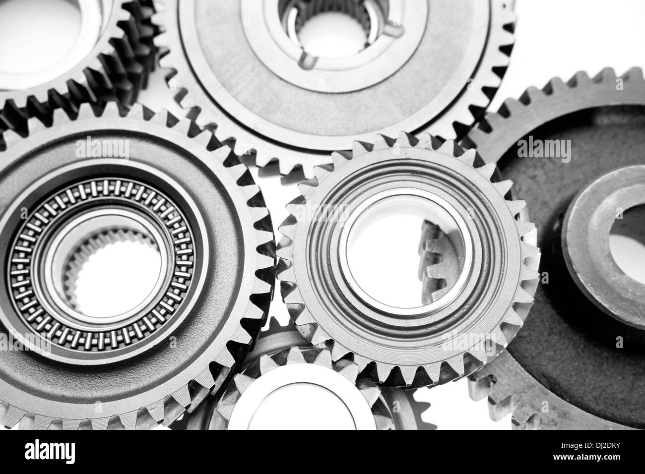 Metal cog gears joining together Stock Photo - Alamy