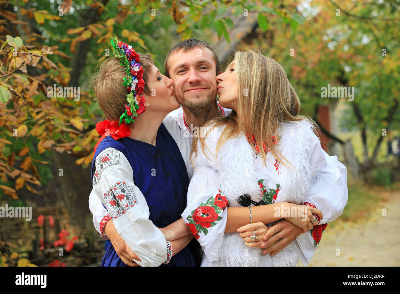 Young people in Ukrainian style clothing flirting outdoors Stock Photo ...