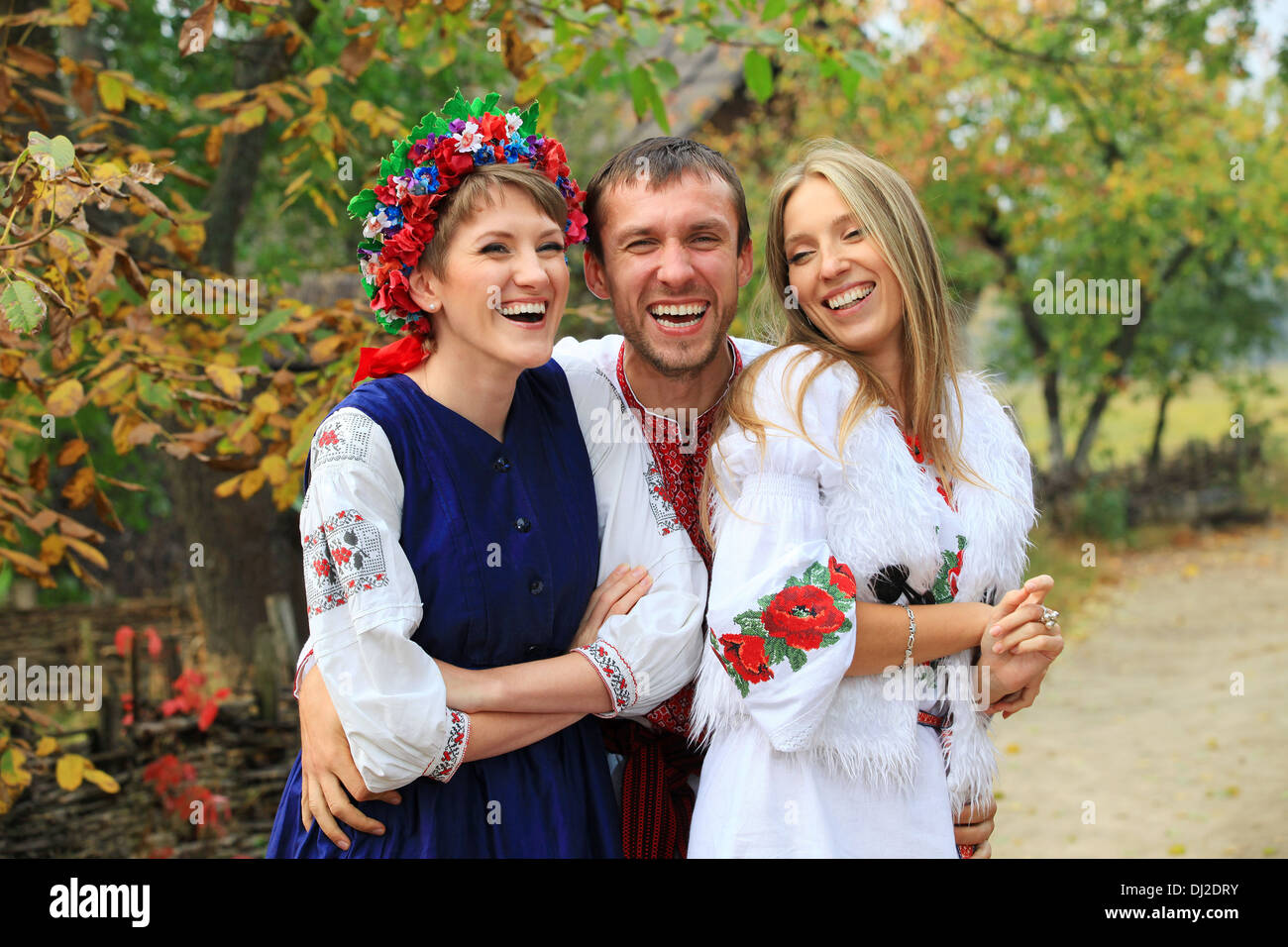 Young people in Ukrainian style clothing flirting outdoors Stock Photo ...