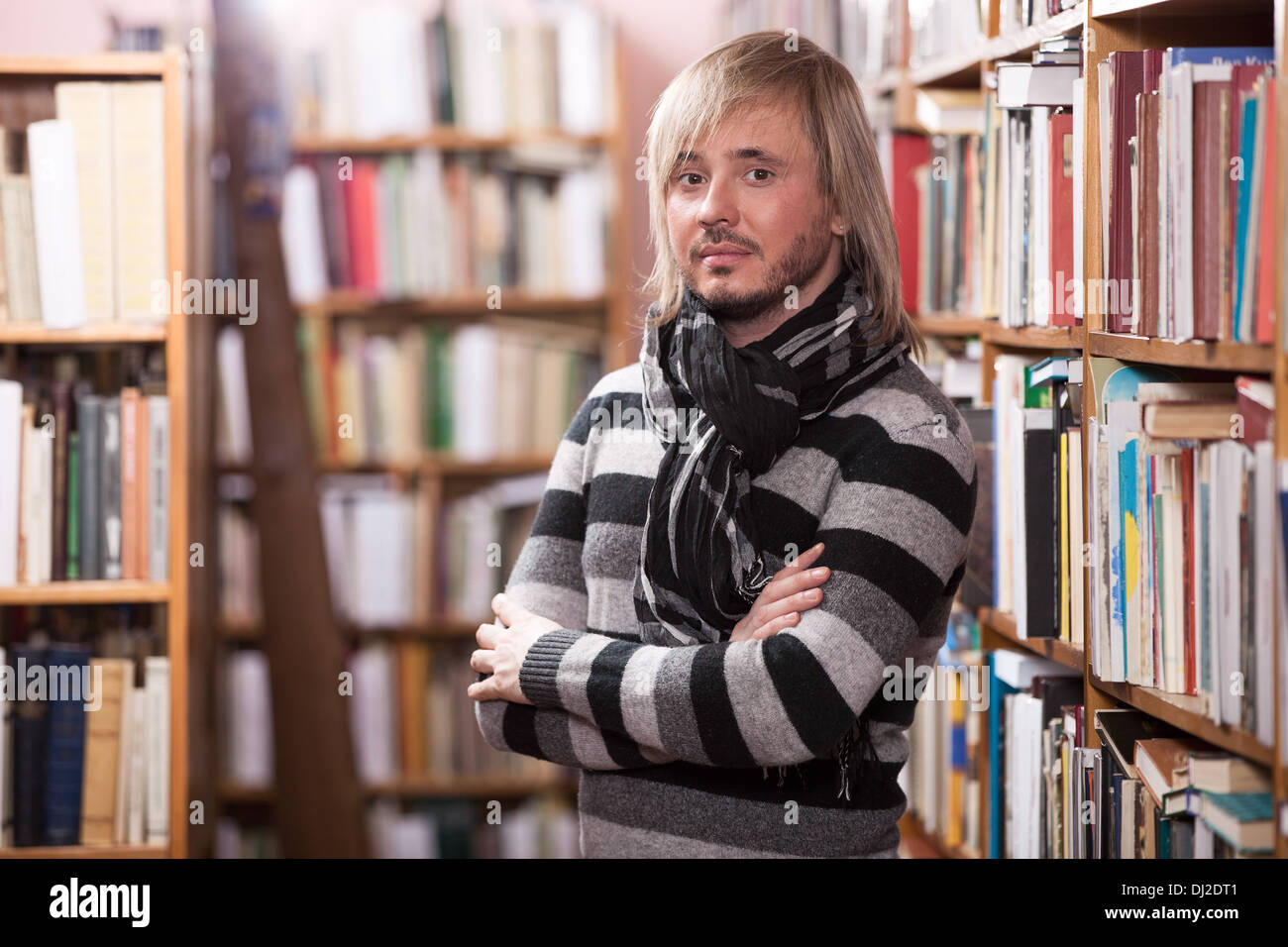 Attractive man posing in library hi-res stock photography and images ...