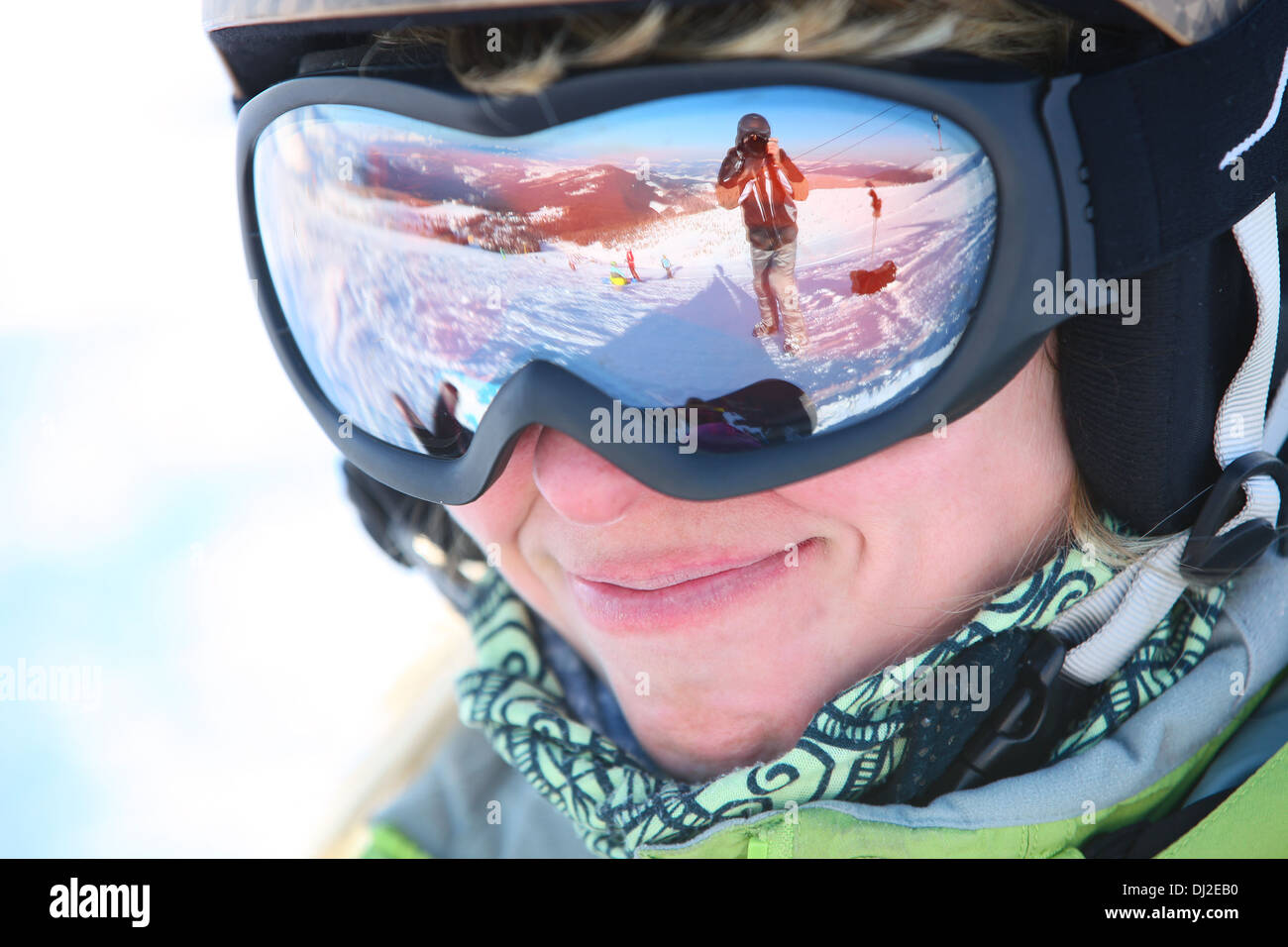 Closeup portrait of a female skier standing on a skiing slope Stock ...