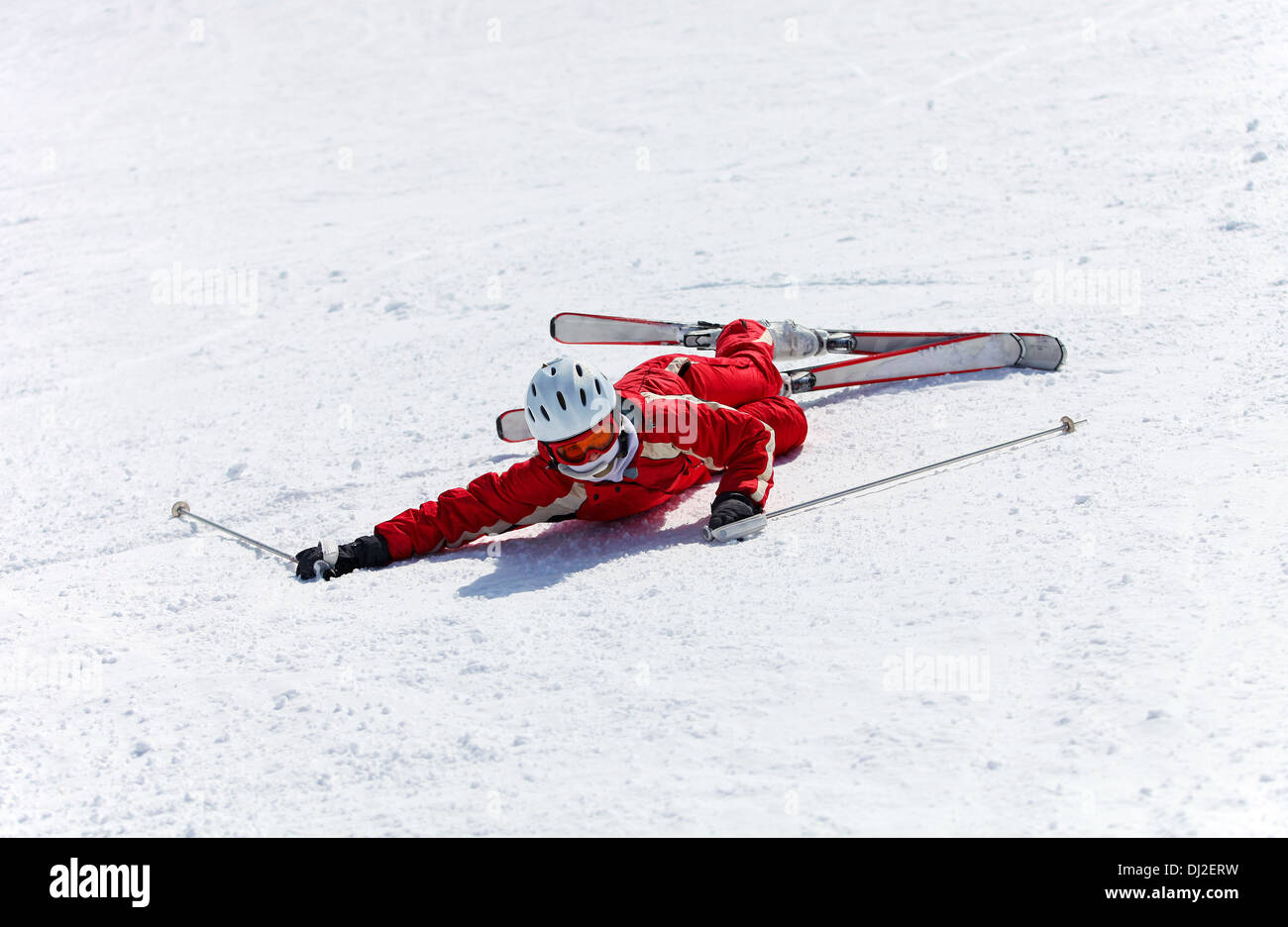 Female skier after falling down on a mountain slope Stock Photo - Alamy