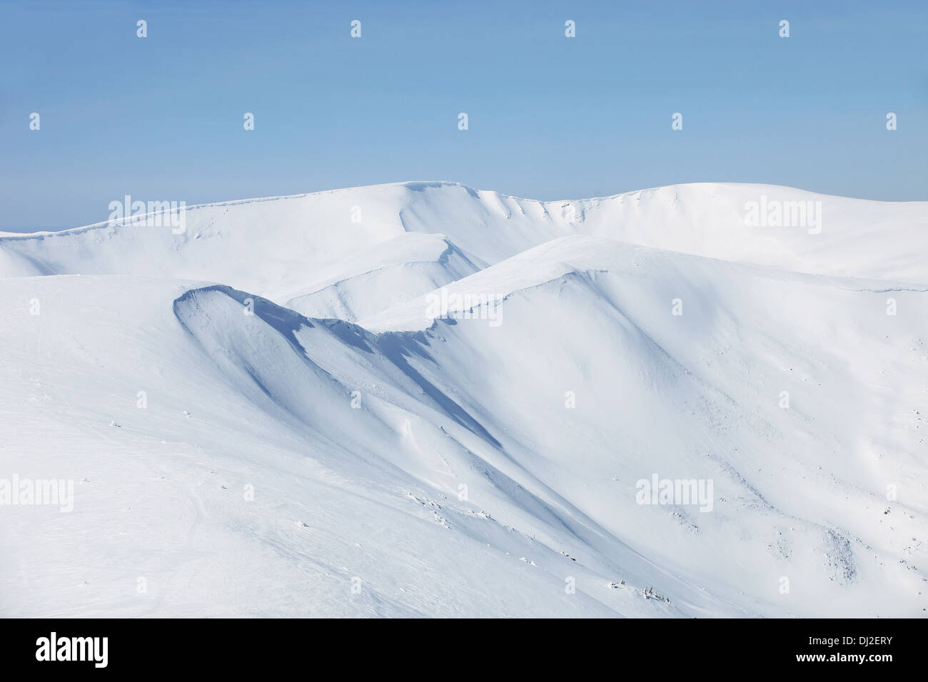 Mountains slopes covered with snow Stock Photo - Alamy