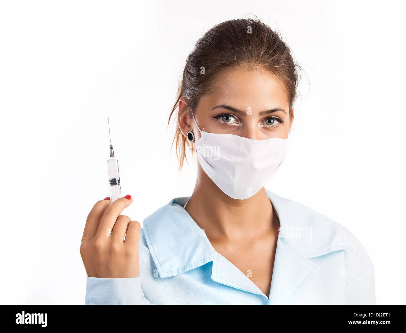 A young doctor holding injection over white background Stock Photo - Alamy