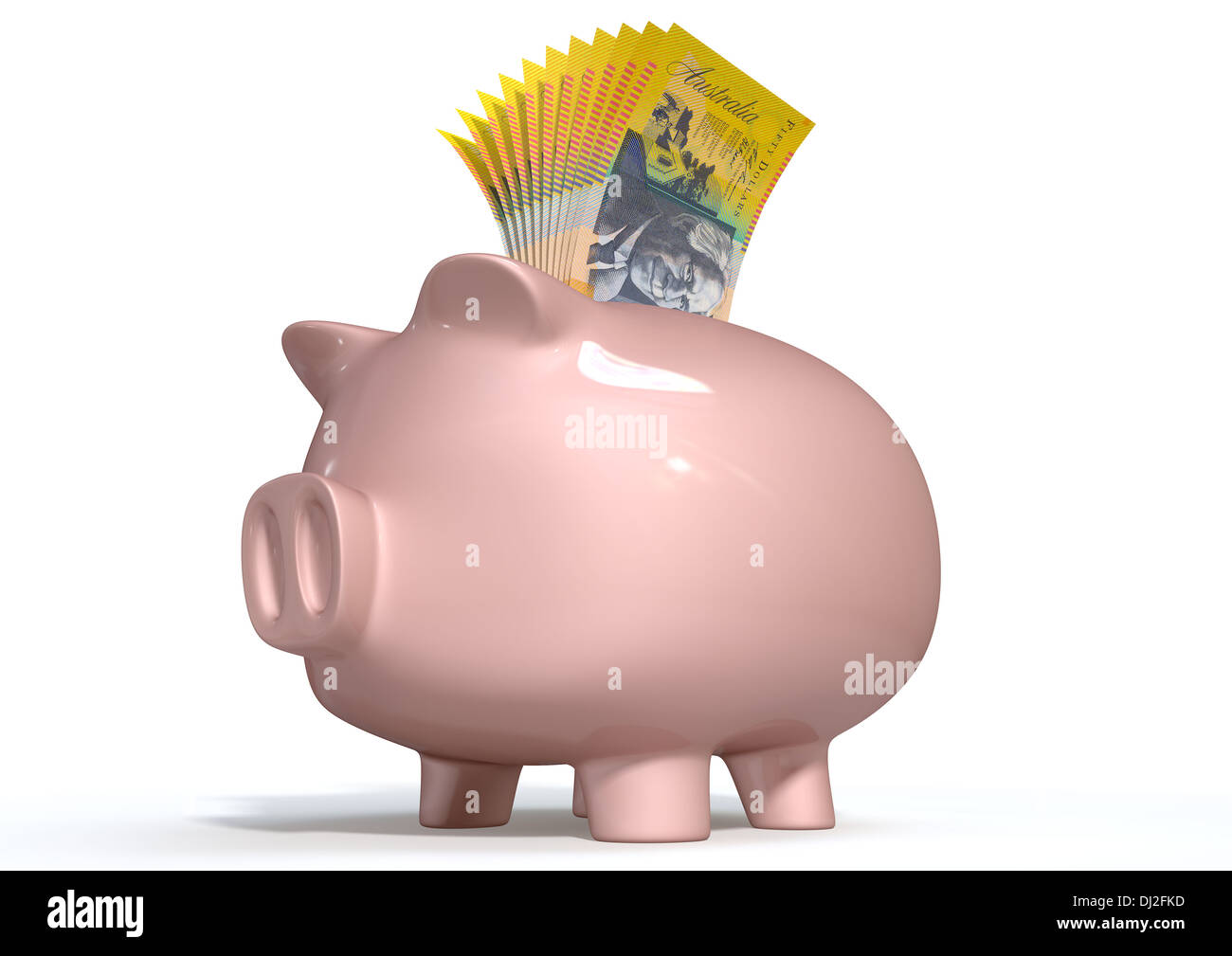 A pink ceramic piggy bank on an isolated white background with a wad of ...