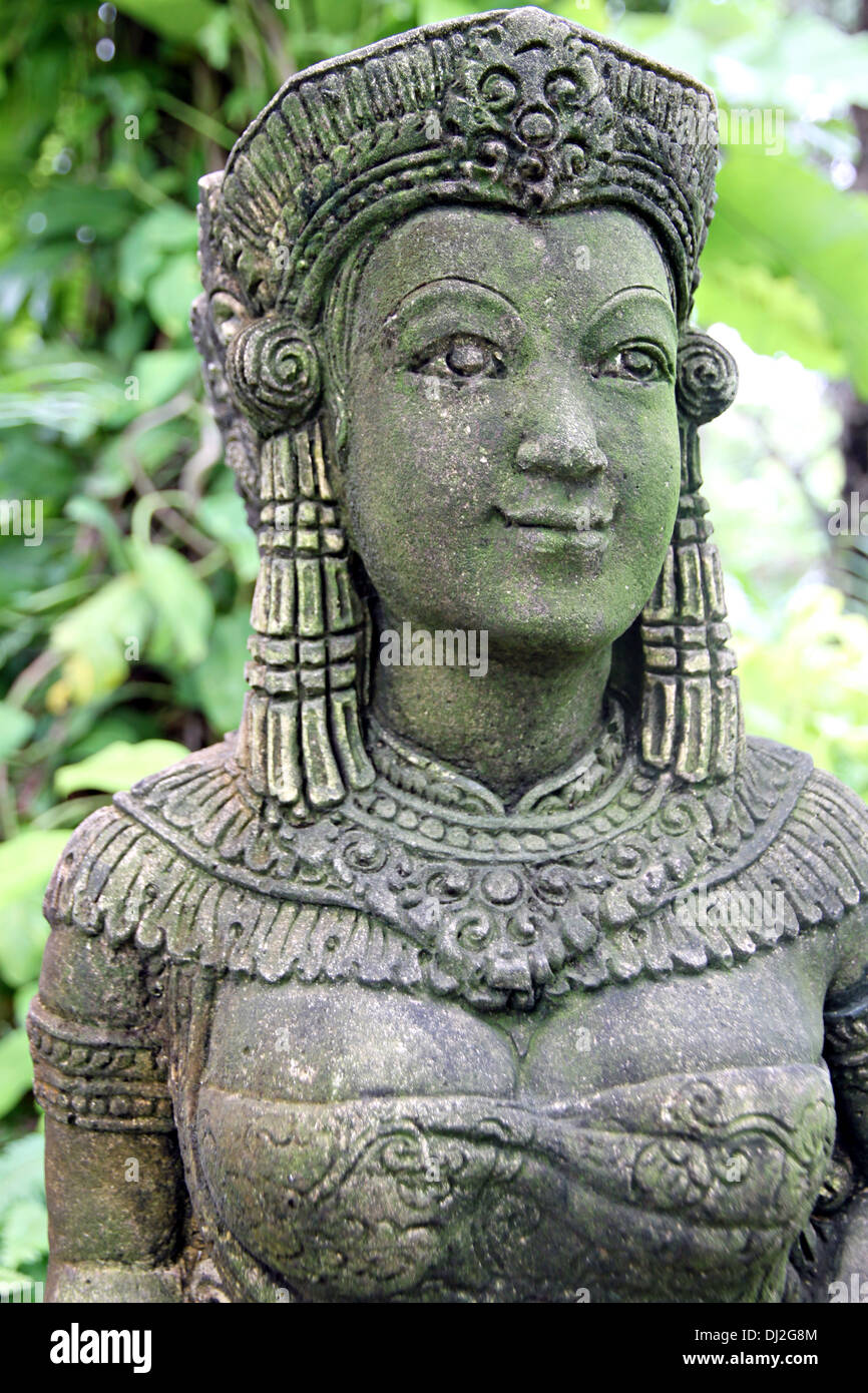 Ancient statue of a woman in the garden and Look at her smile a little ...