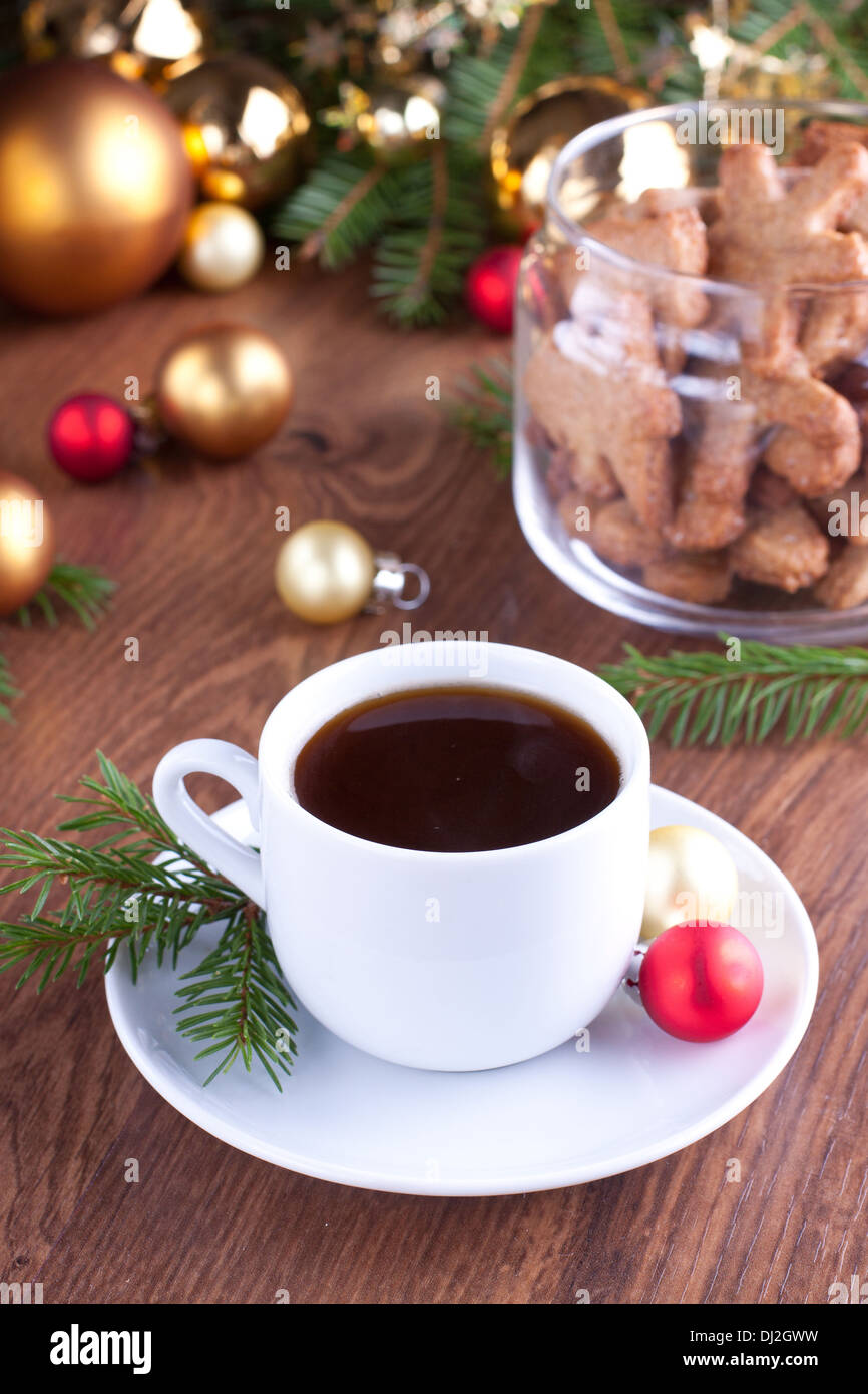 Cup of coffee with baubles and gingerbread cookies on background Stock ...