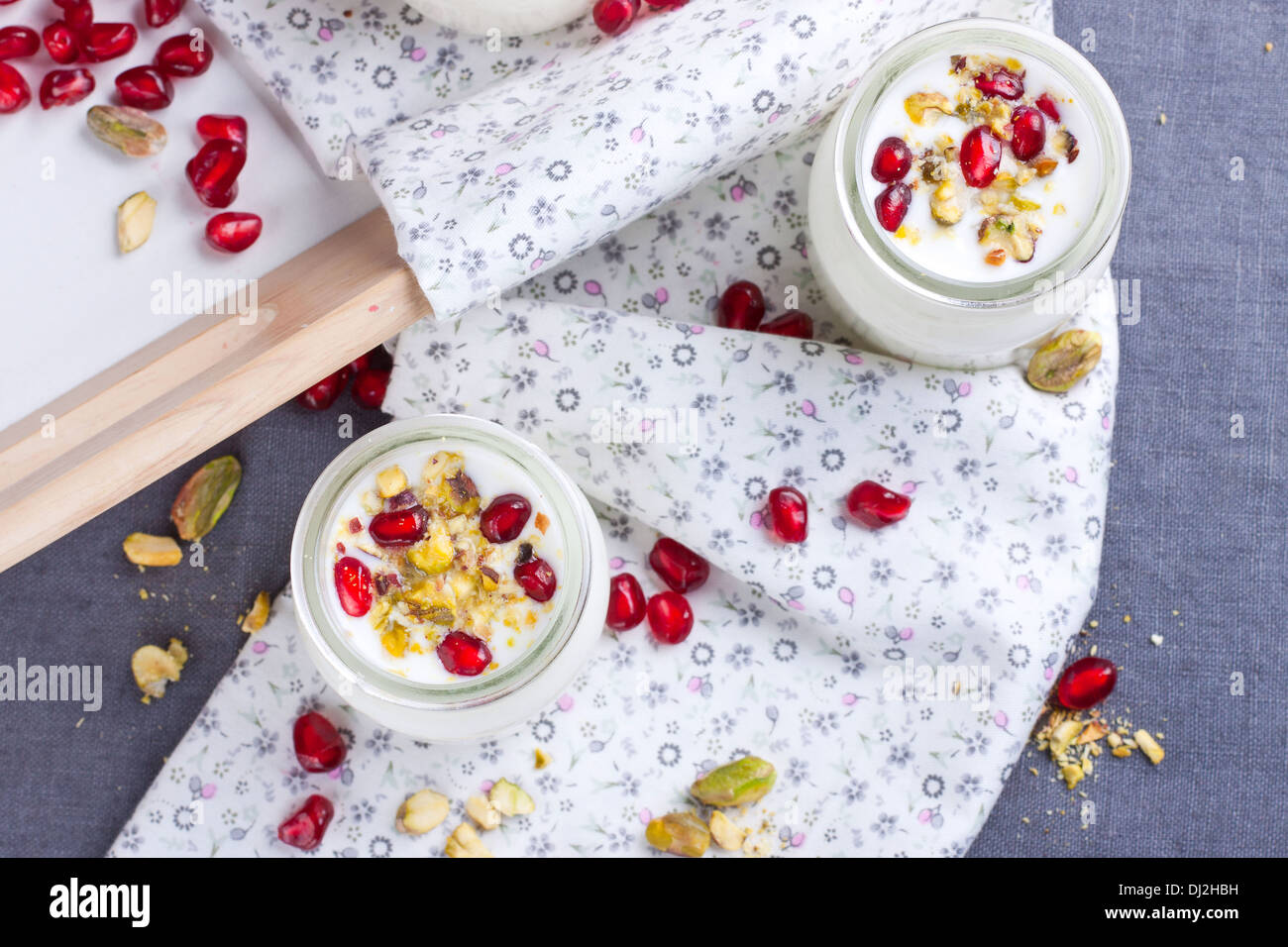 Two portions of yogurt in glass jars Stock Photo - Alamy