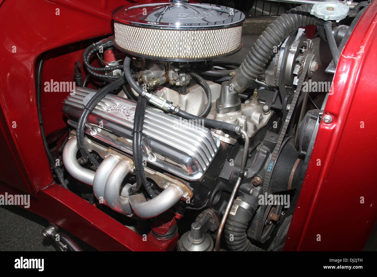 Old large V engine in vehicle Stock Photo - Alamy