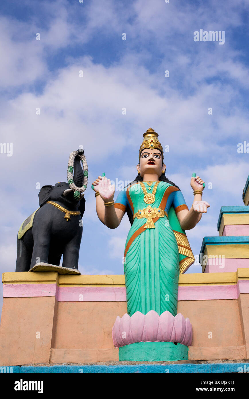 Colourful statue of hindu goddess Lakshmi on a south Indian rural ...