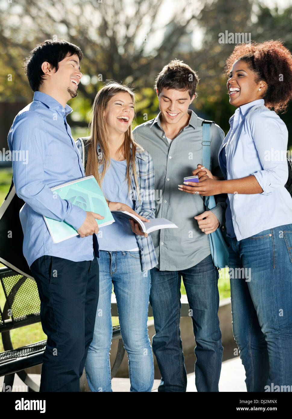 Happy Students Standing In Campus Stock Photo - Alamy