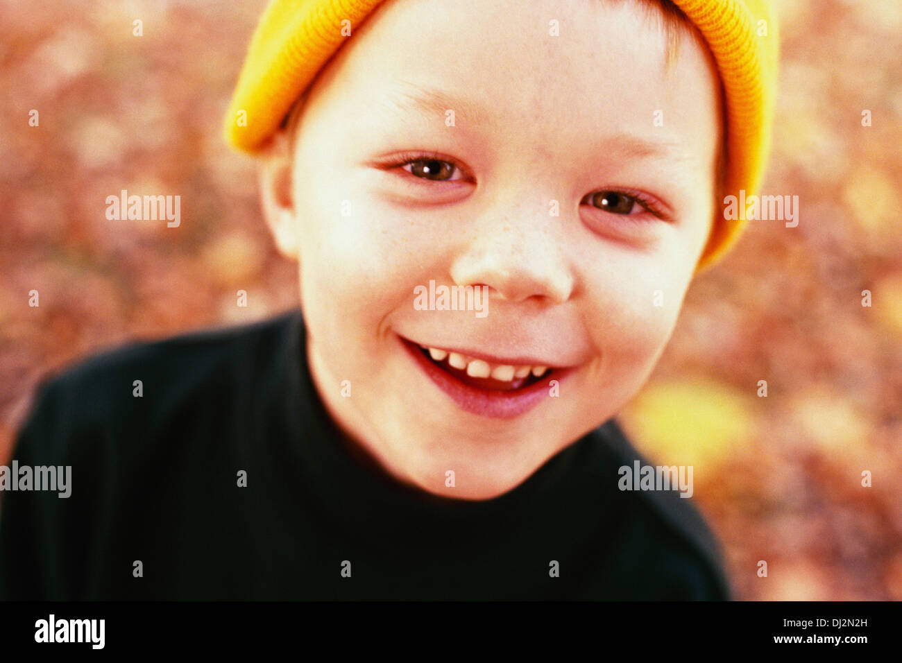 Boy Wearing a Yellow Hat Stock Photo - Alamy