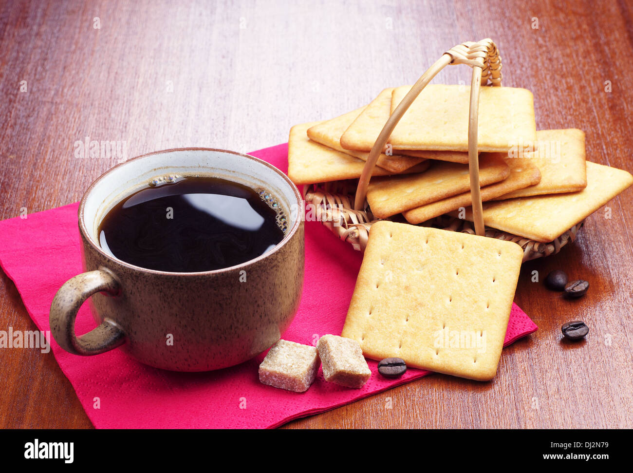 Cup of coffee and cheese crackers on table Stock Photo - Alamy