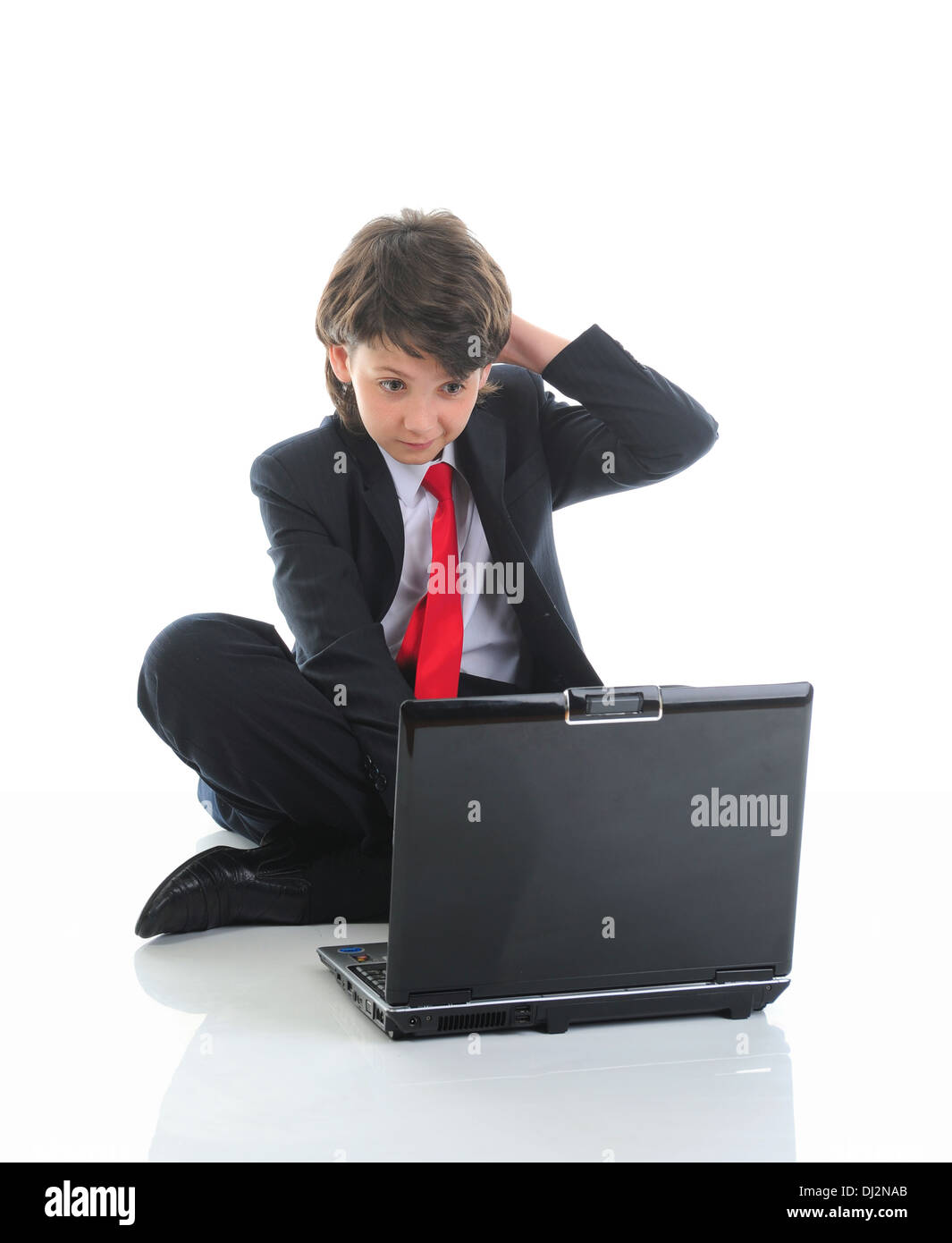 boy in business suit sitting in front of computer Stock Photo - Alamy