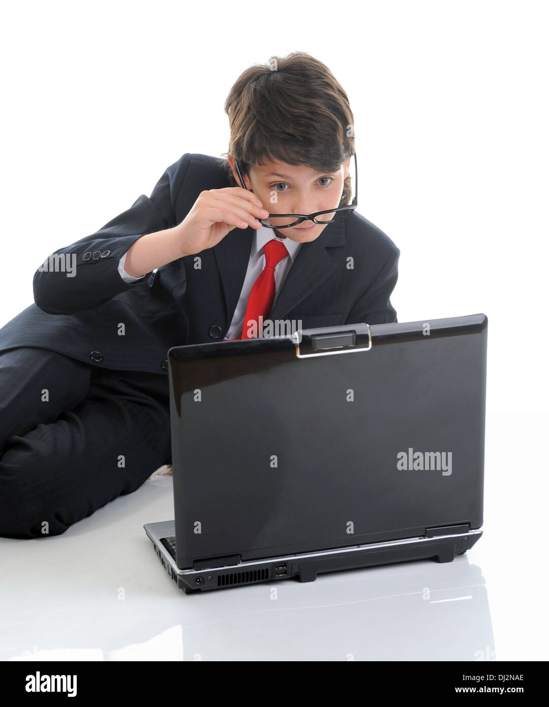 boy in business suit sitting in front of computer Stock Photo - Alamy