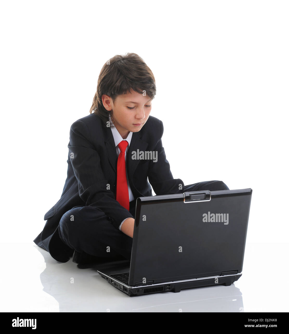 boy in business suit sitting in front of computer Stock Photo - Alamy