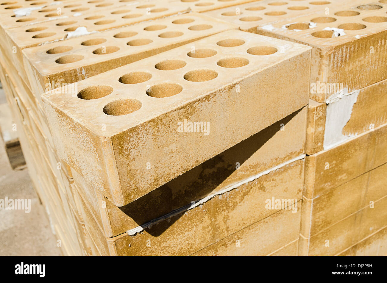 Close up of stack of yellow clay bricks Stock Photo - Alamy