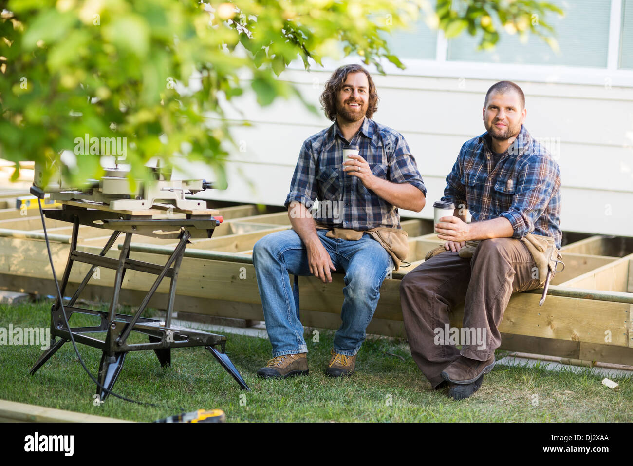 Man sitting on wood plank hi-res stock photography and images - Alamy