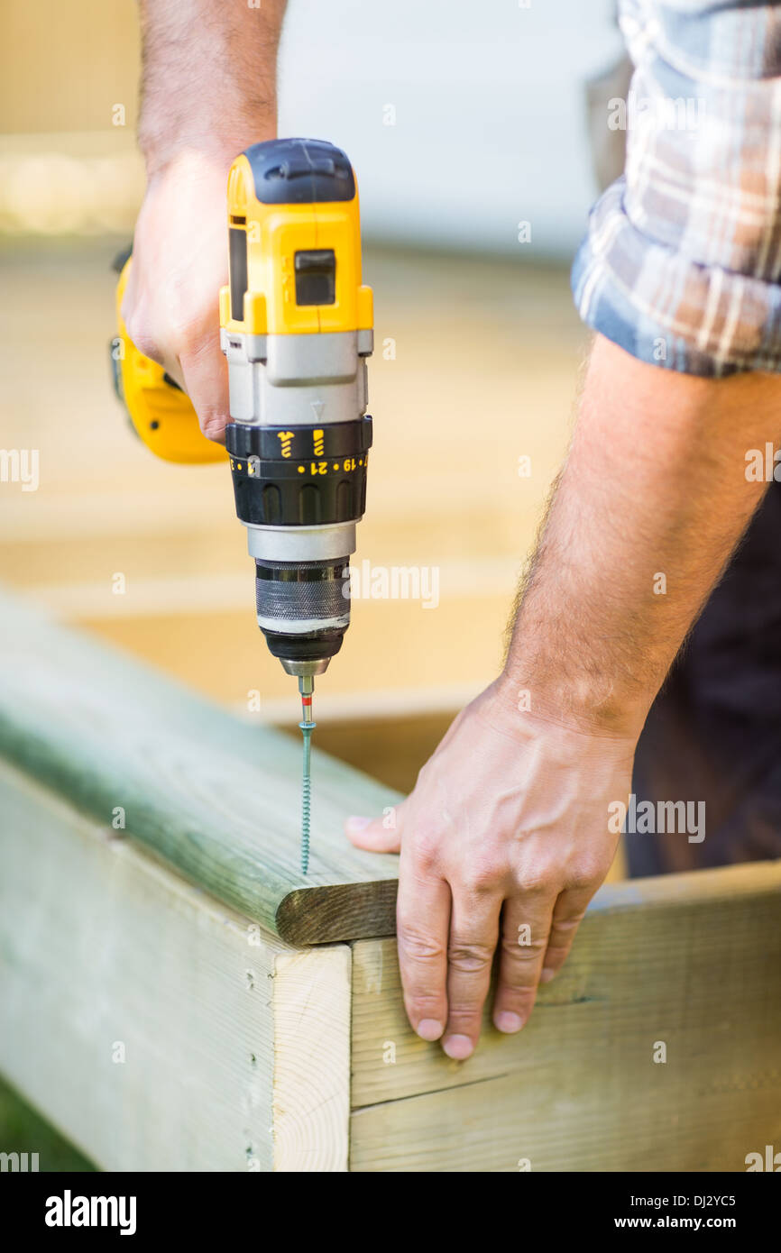 Male carpenters hands using screw hi-res stock photography and images ...