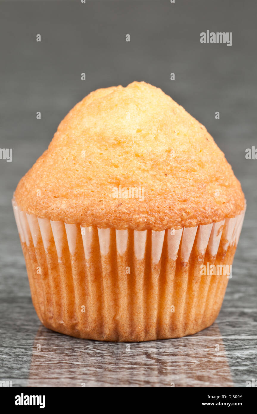 Single muffin on reflective background Stock Photo - Alamy
