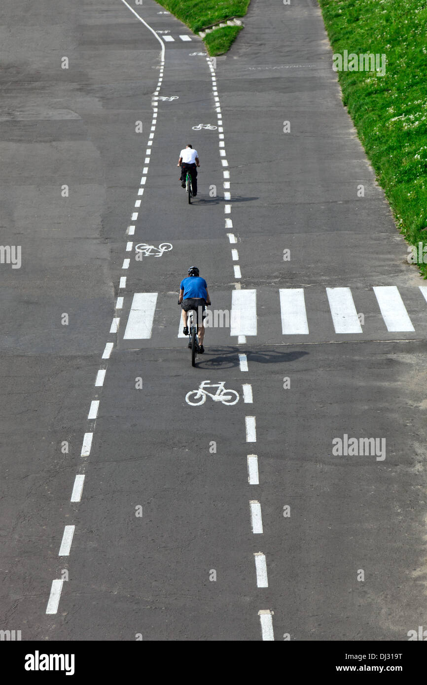 Cyclist riding on pavement hi-res stock photography and images - Alamy
