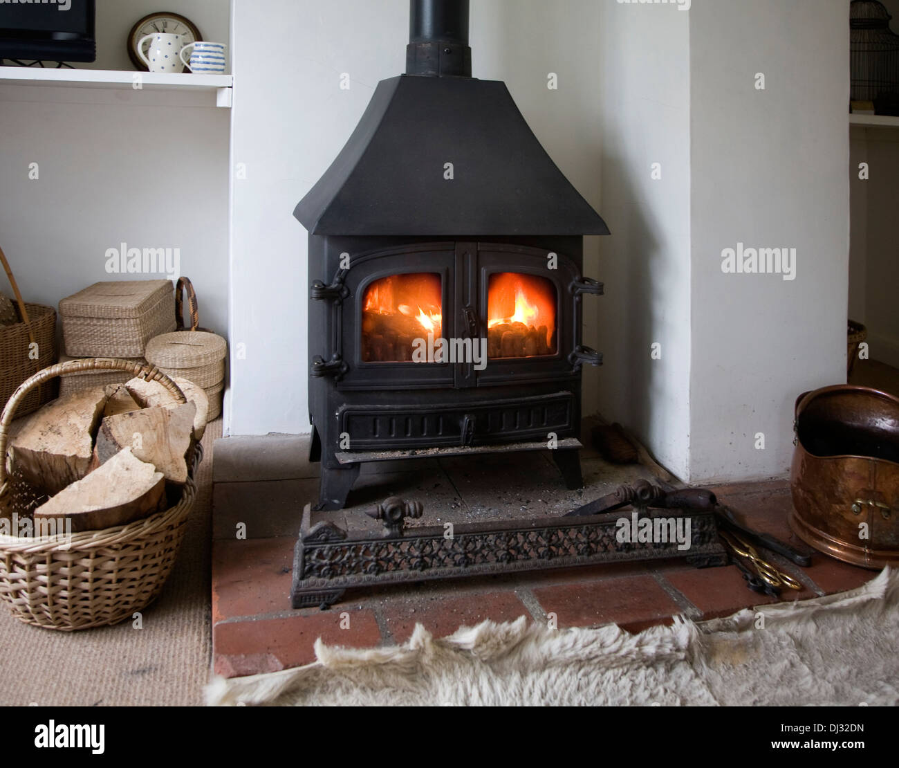 Roaring flames home multi-fuel stove fire Stock Photo - Alamy
