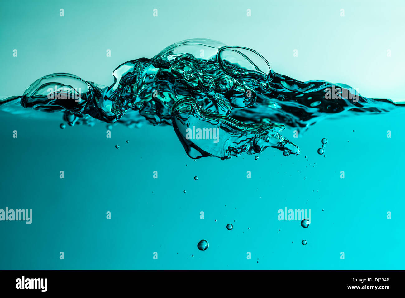 Bubbles breaking the waters surface Stock Photo - Alamy