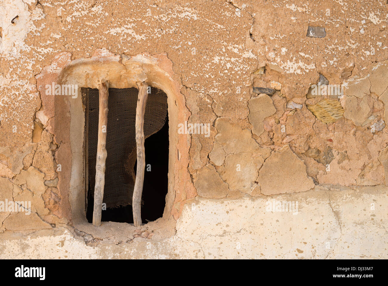Old adobe wall with a weathered window Stock Photo - Alamy