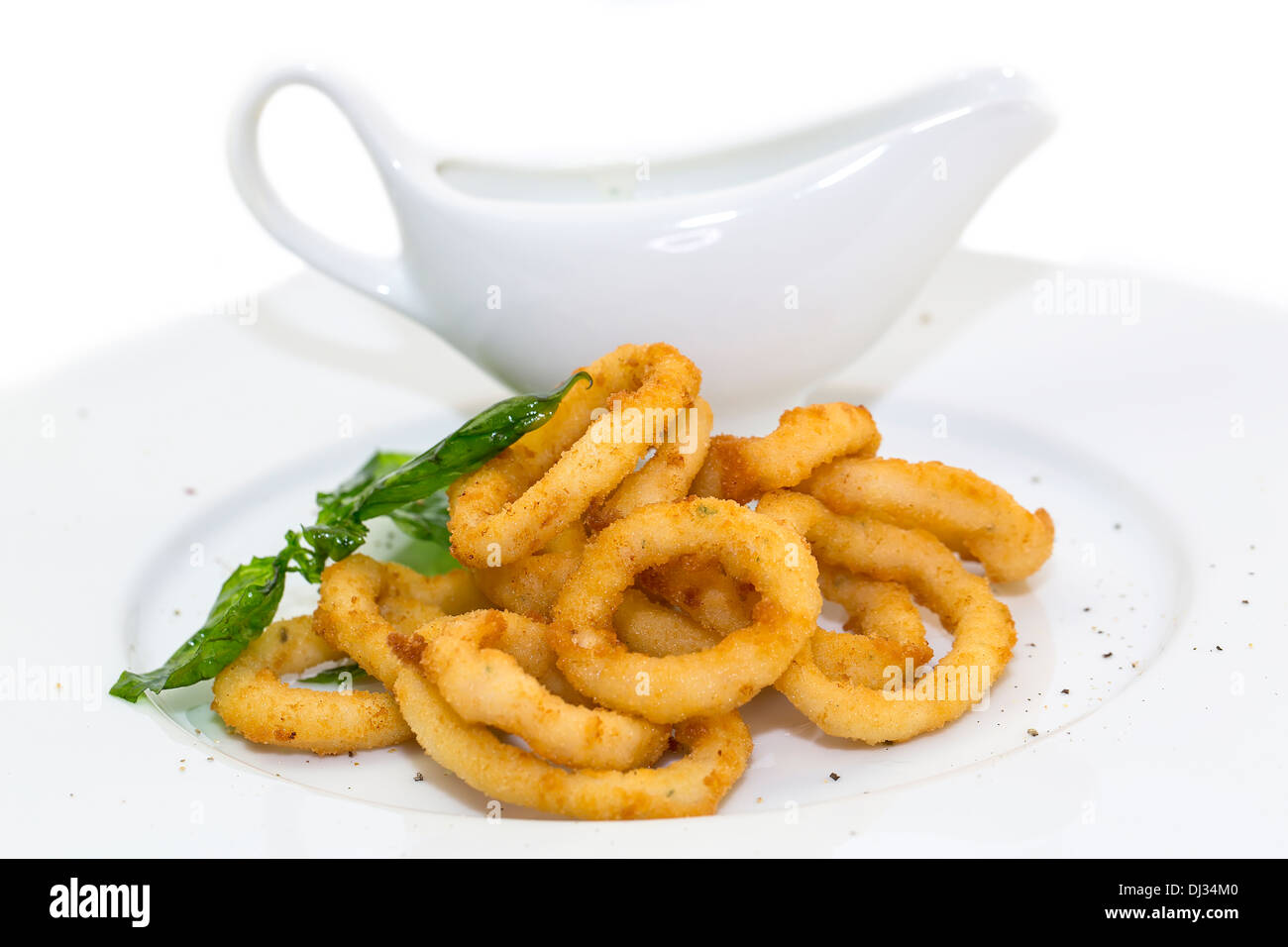fried calamari rings on a white background Stock Photo - Alamy