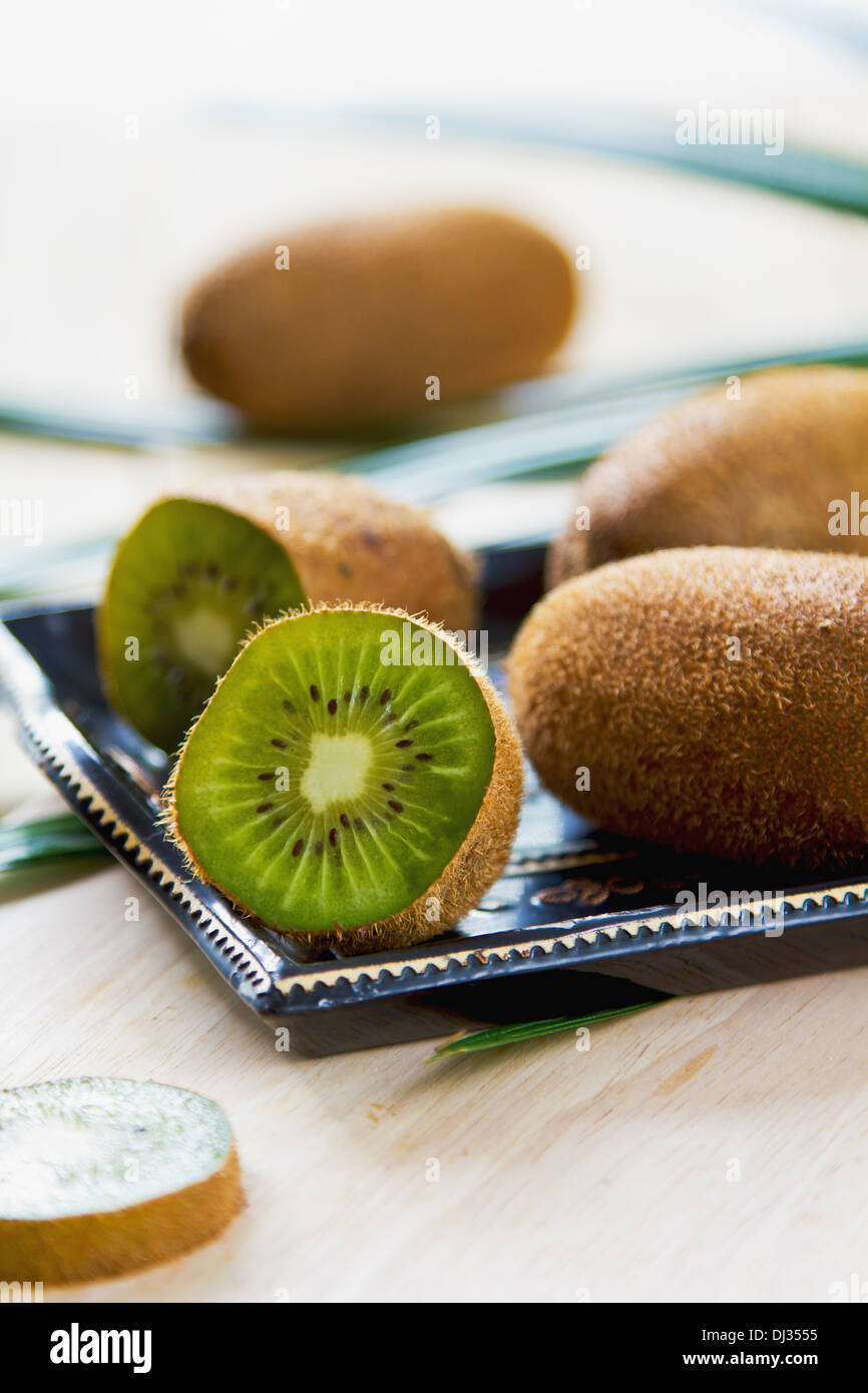Kiwi fruit Bruno's type on a wood tray Stock Photo - Alamy