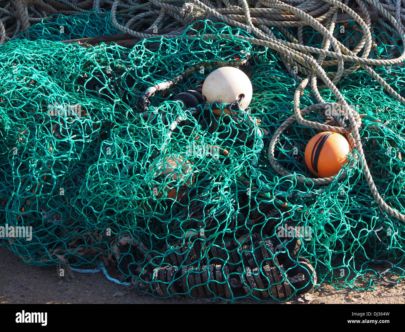 offloaded fishing trawler nets, floats and gear on the quayside Stock ...