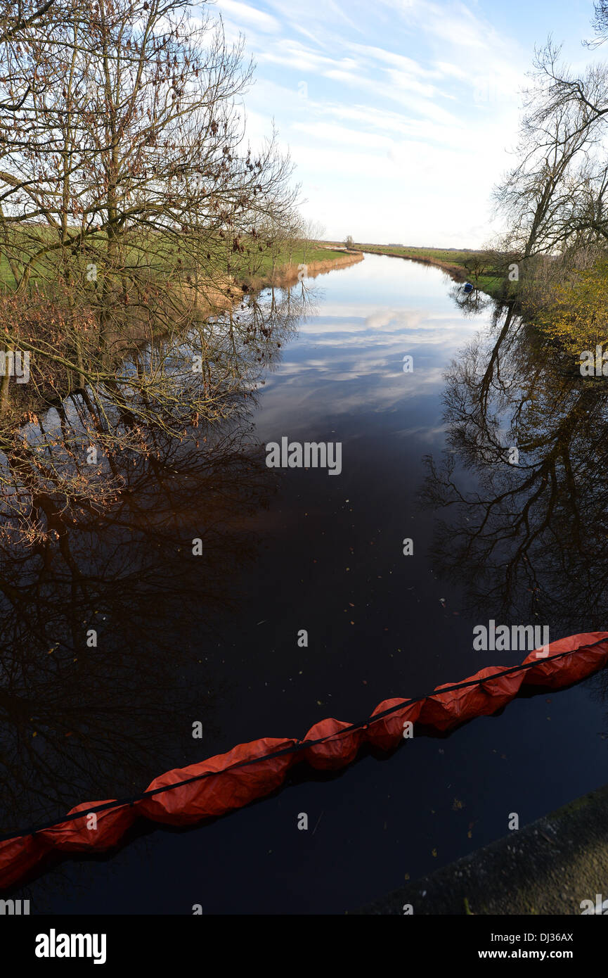 Zettel, Germany. 20th Nov, 2013. An oil barrier lies on the water near ...