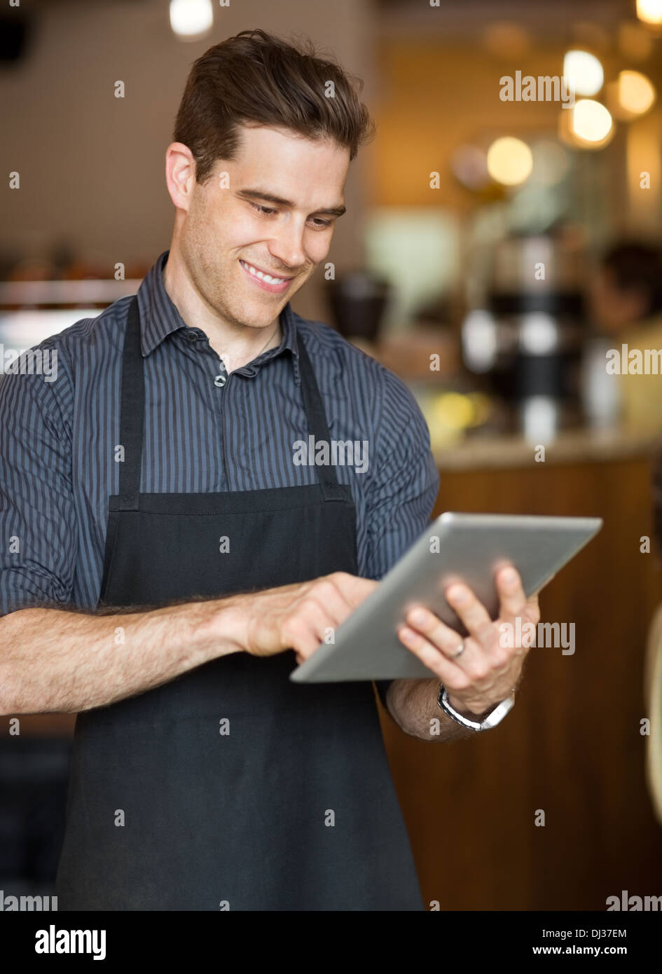Worker using tablet in beverage hi-res stock photography and images - Alamy