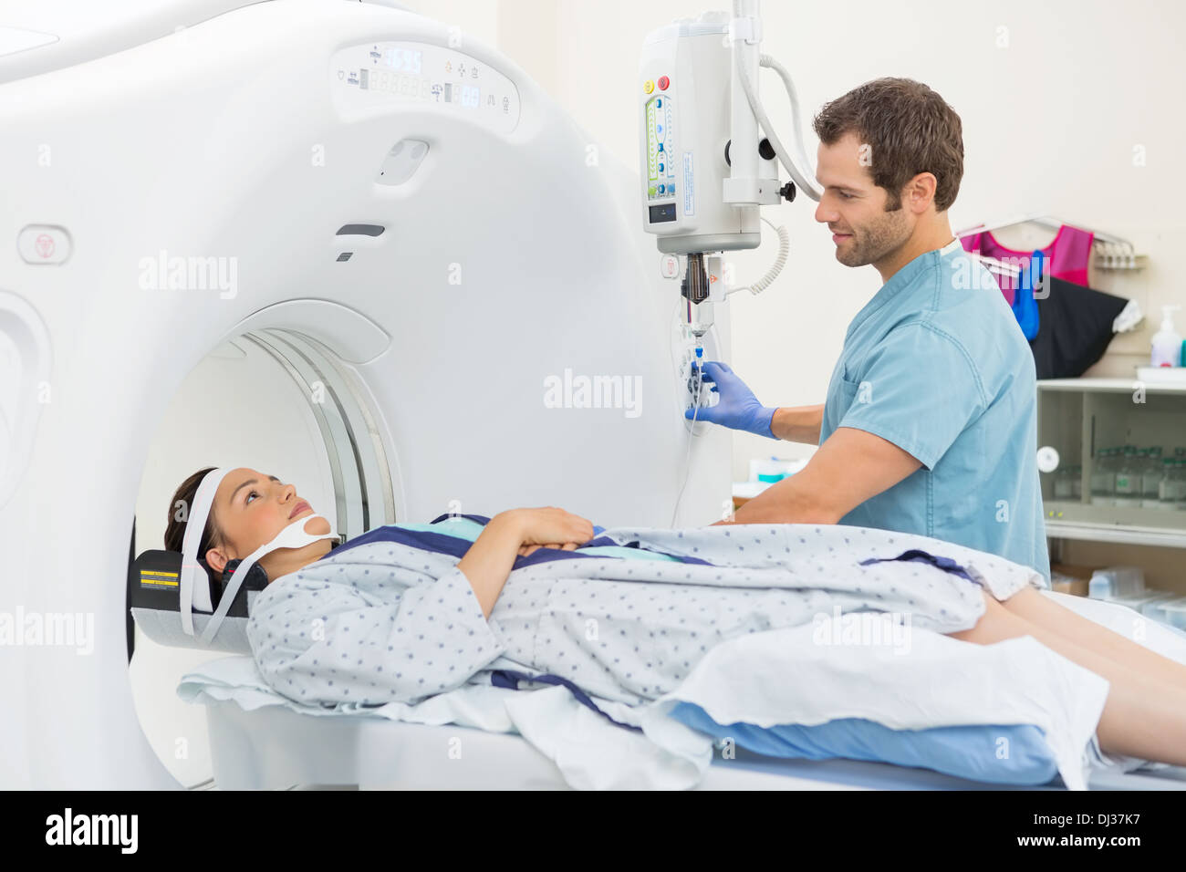 Nurse Looking At Patient Undergoing CT Scan Stock Photo - Alamy