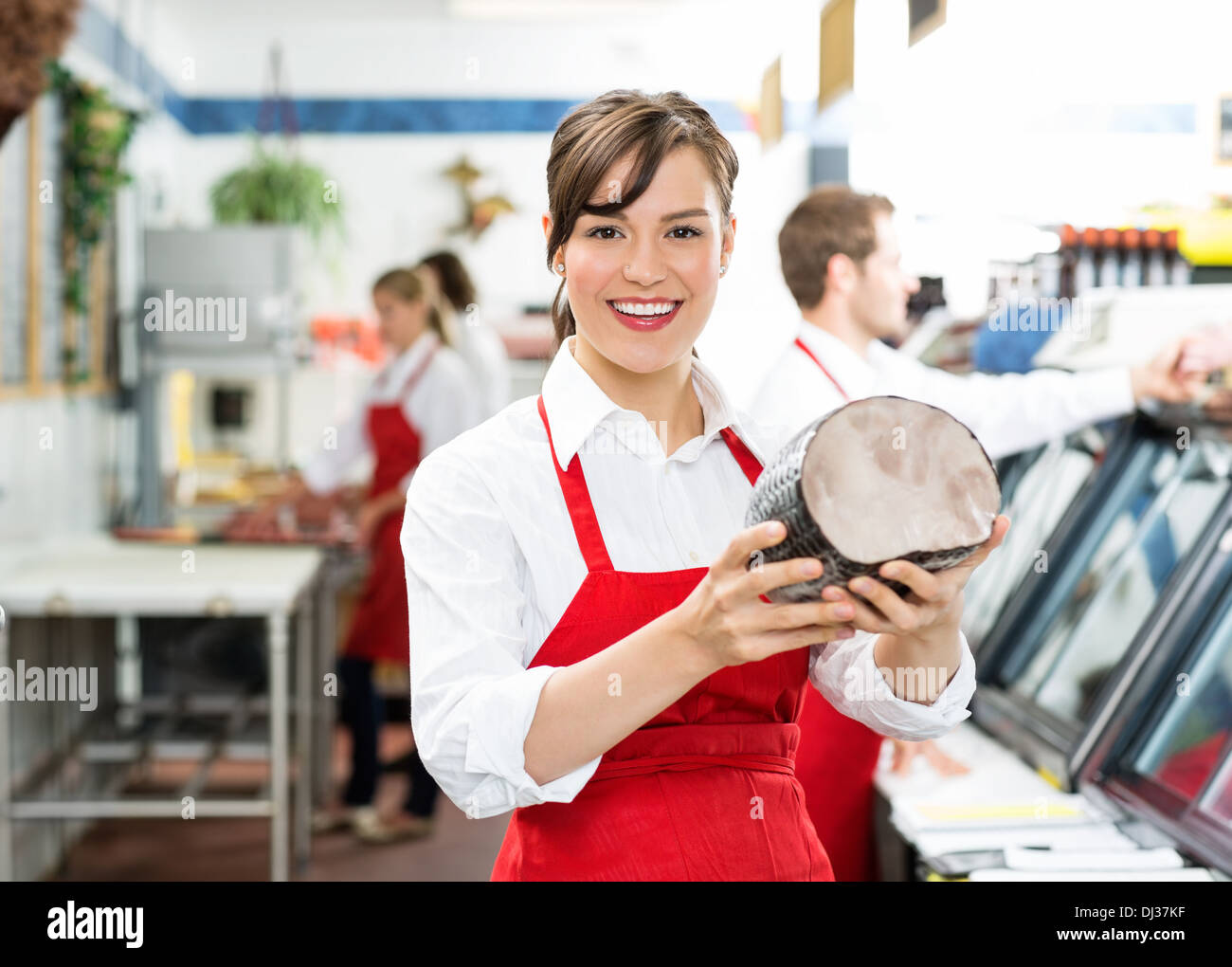 Happy Female Butcher Holding Large Ham Stock Photo - Alamy