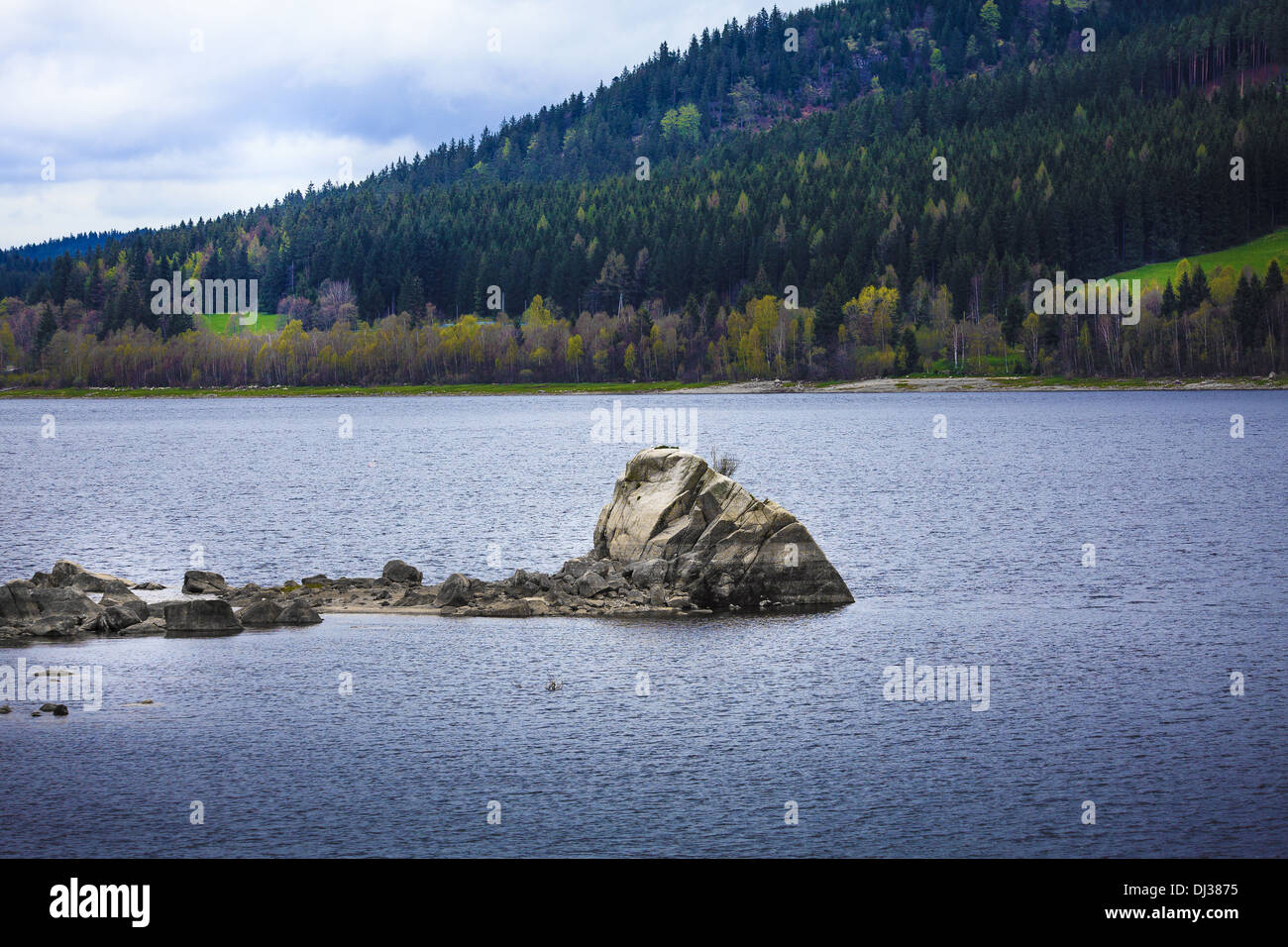 Rock on the lake Stock Photo - Alamy