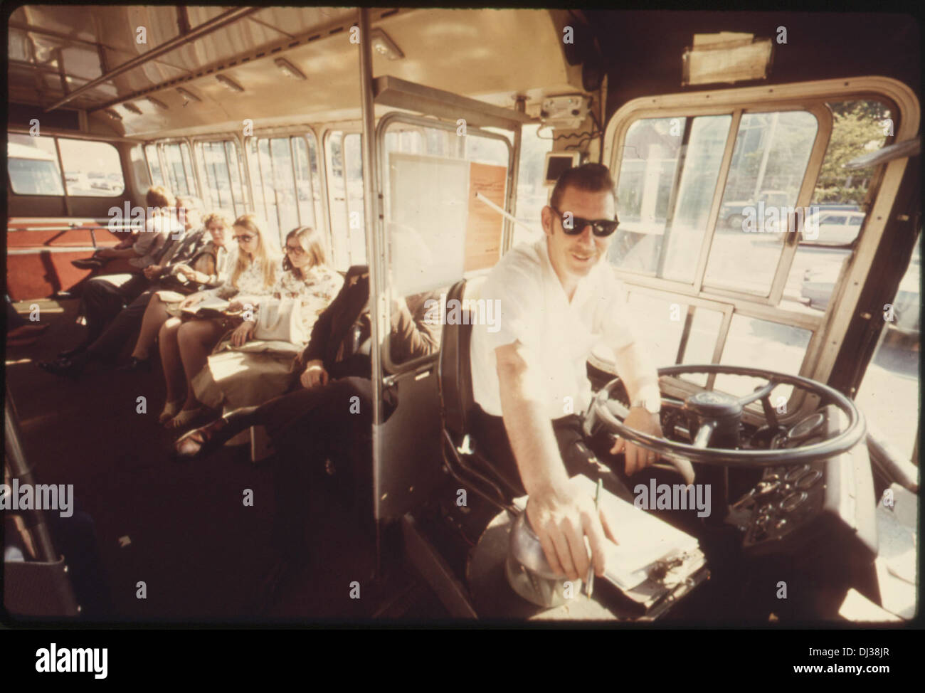 BUS DRIVER AND PASSENGERS ON A DIAL A RIDE RADIO DISPATCHED DOOR-TO ...