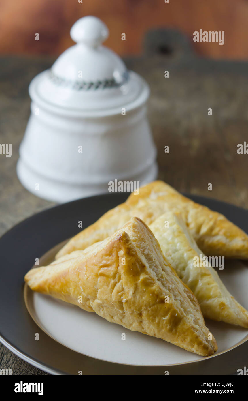 close up puff pastry on the plate over wooden background , sweet bread ...