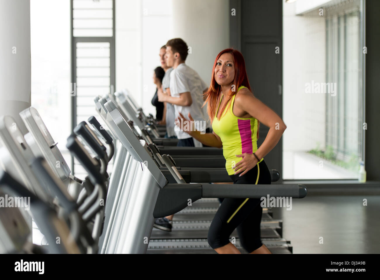 Female running on treadmills hi-res stock photography and images - Alamy