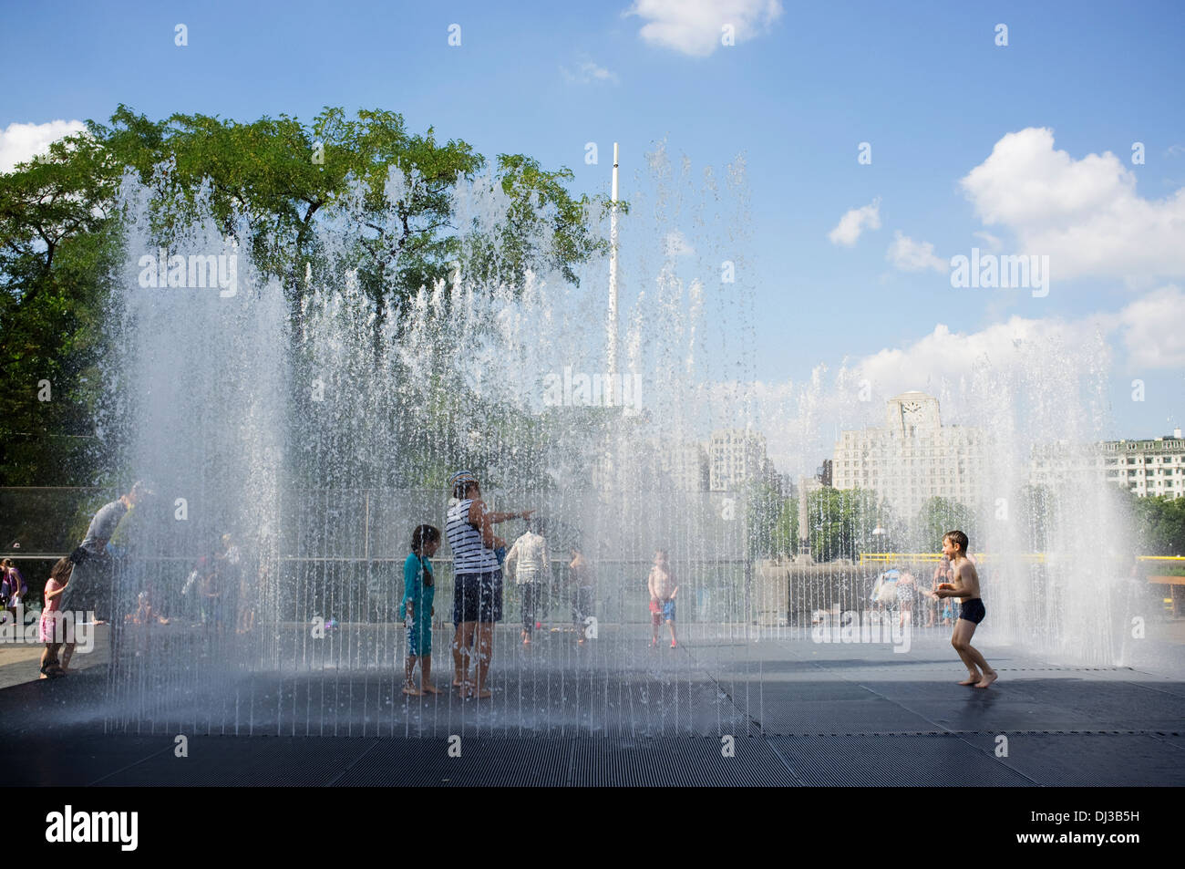Kids playing in Danish artist Jeppe Hein's interactive fountain outside ...