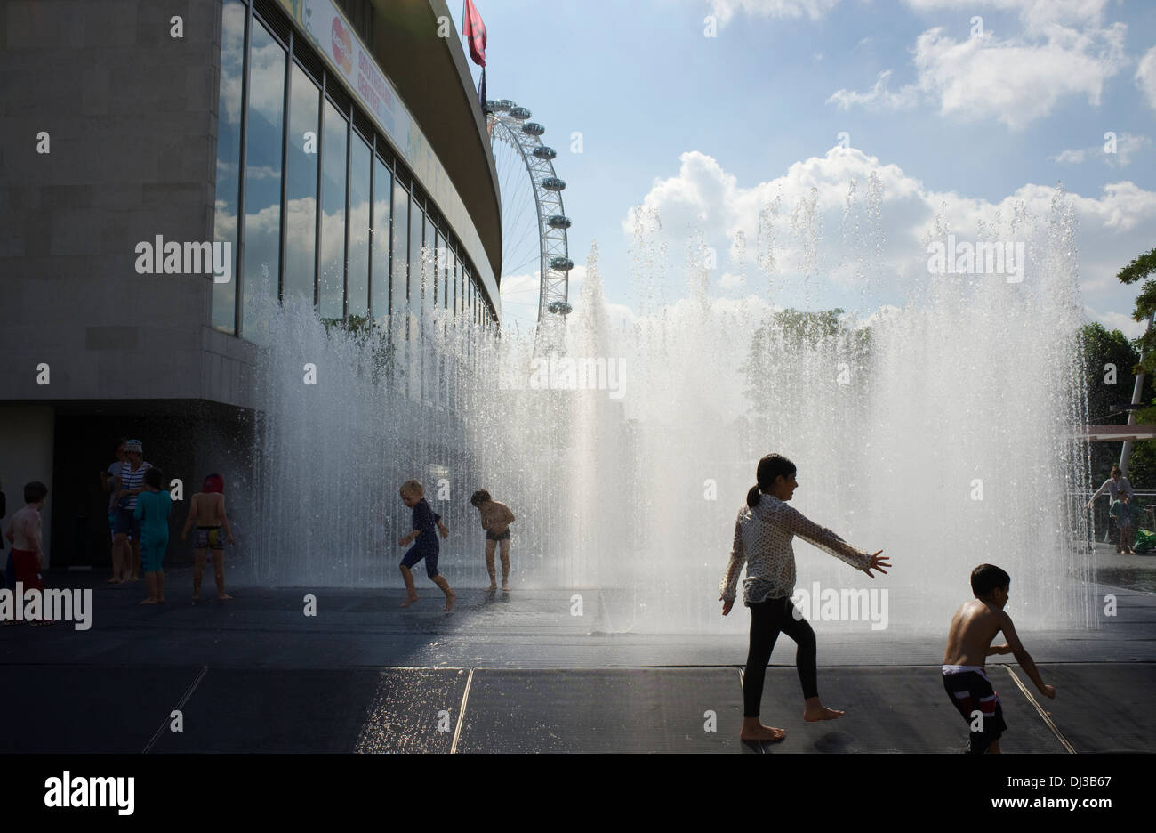 Kids playing in Danish artist Jeppe Hein's interactive fountain outside ...