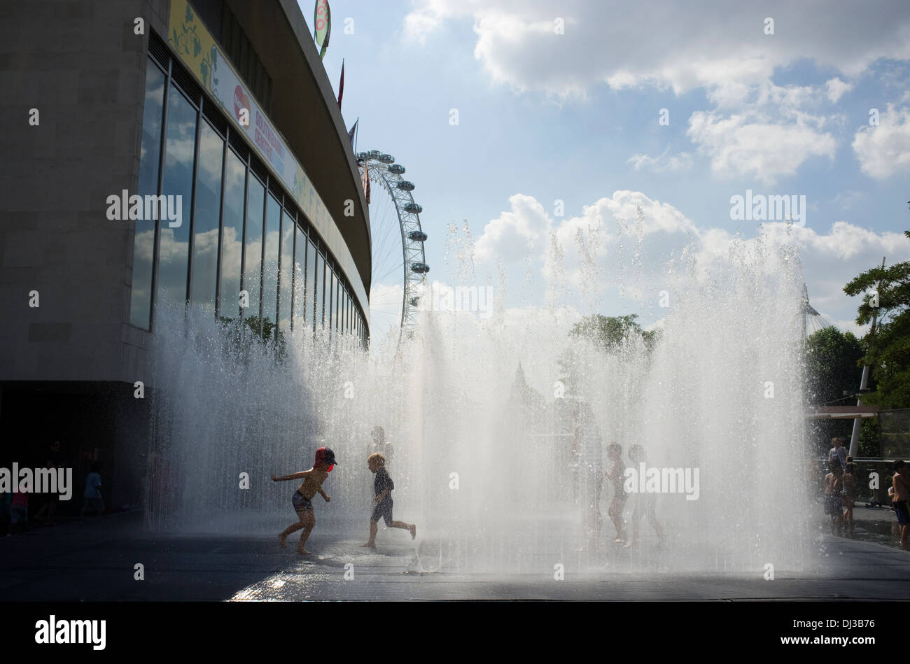 Kids playing in Danish artist Jeppe Hein's interactive fountain outside ...