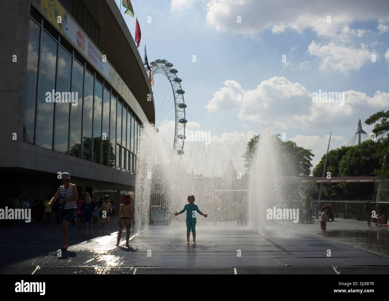 Kids playing in Danish artist Jeppe Hein's interactive fountain outside ...