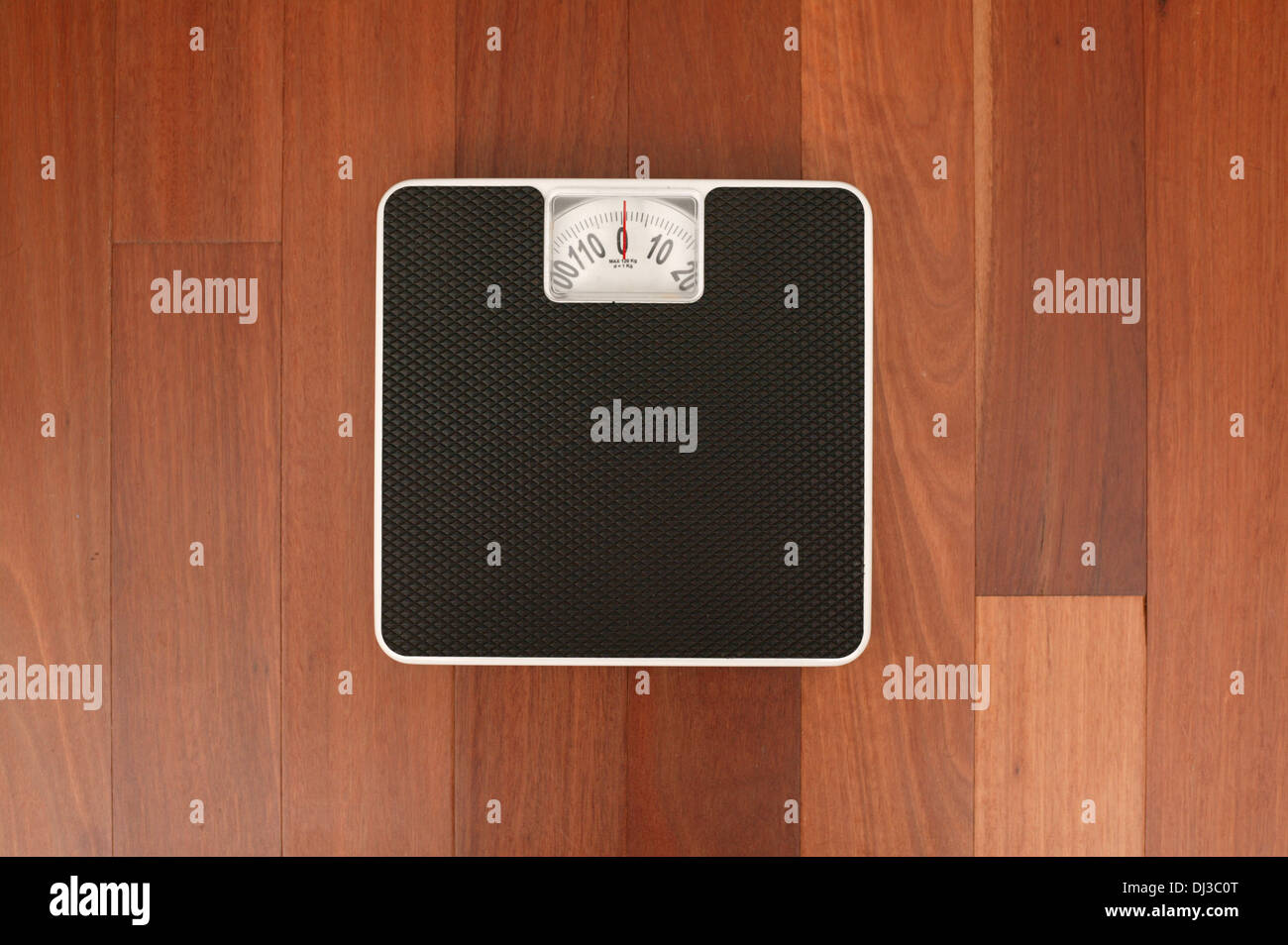 Bathroom scales isolated against a white background Stock Photo - Alamy