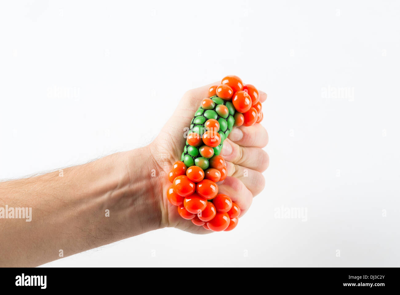 Hand squeezing stress ball hi-res stock photography and images - Alamy