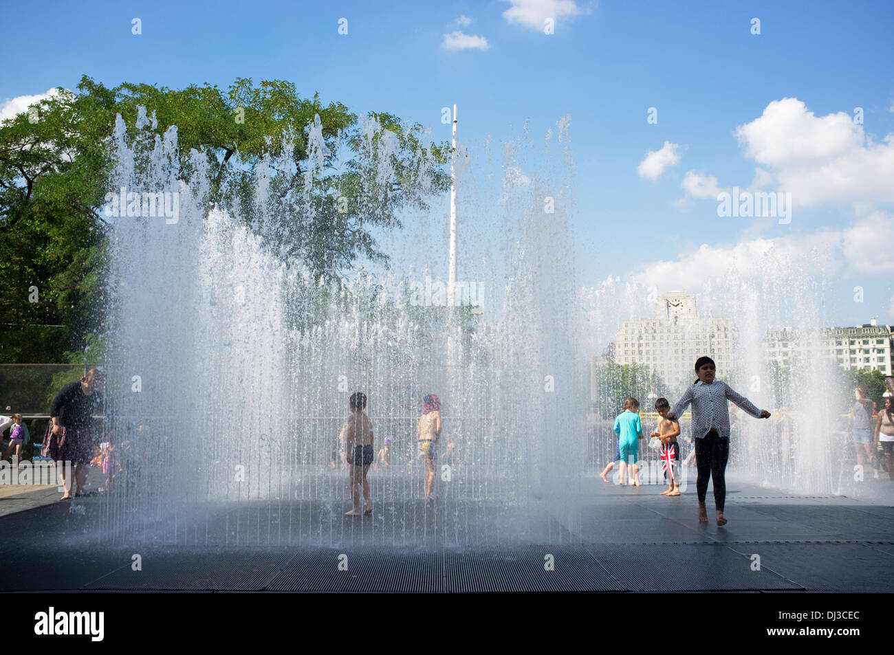 Kids playing in Danish artist Jeppe Hein's interactive fountain outside ...