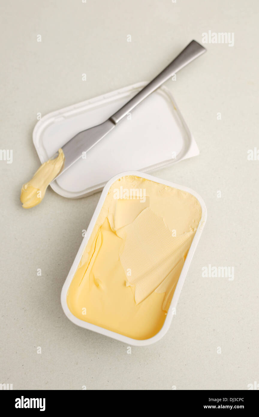 A tub of butter on a kitchen bench Stock Photo - Alamy