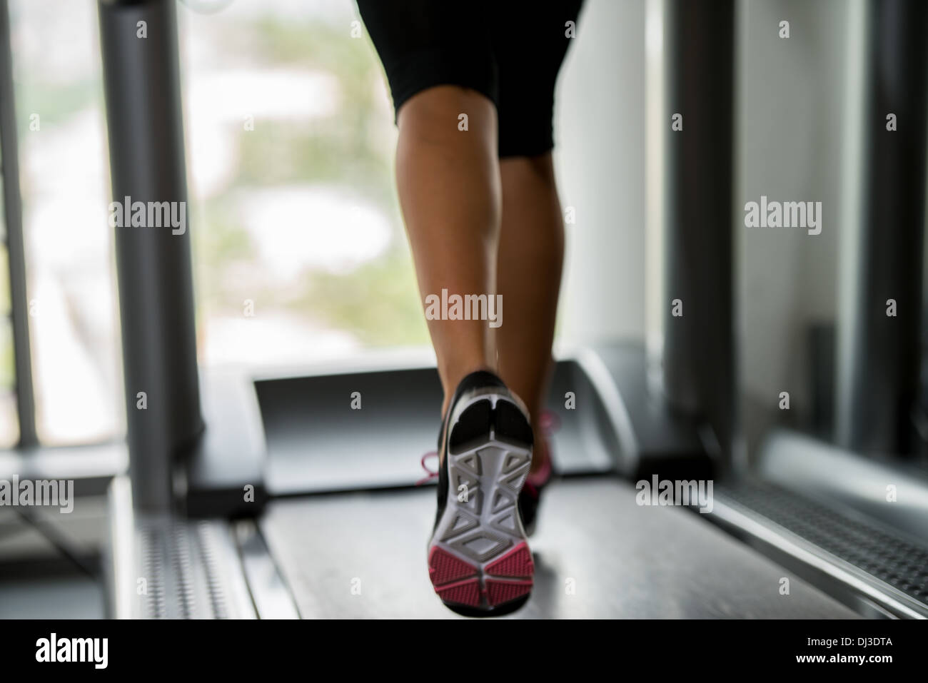 People running on treadmills Stock Photo - Alamy